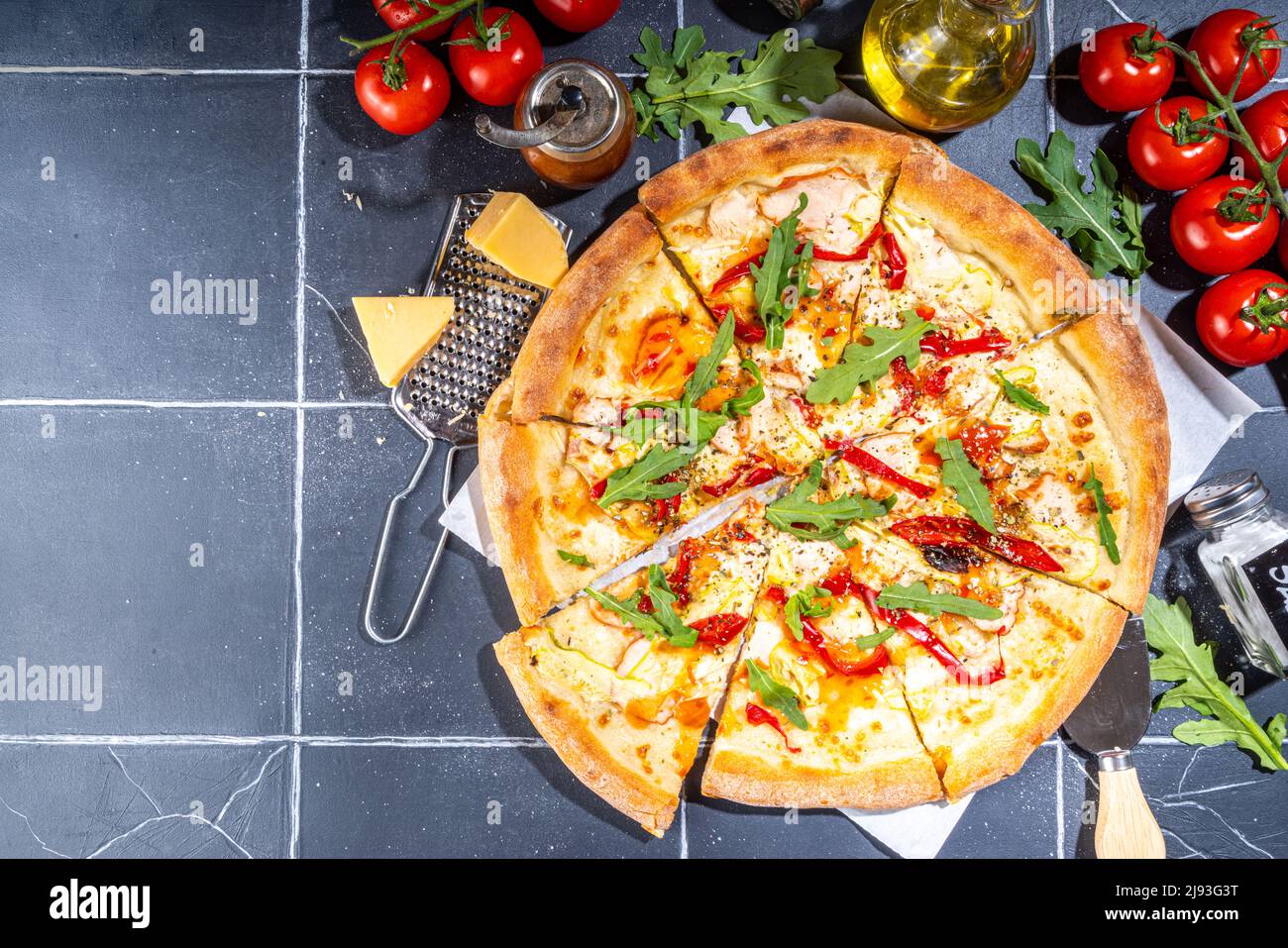 Three various pizzas, served at home or in restaurant on tiled table ...