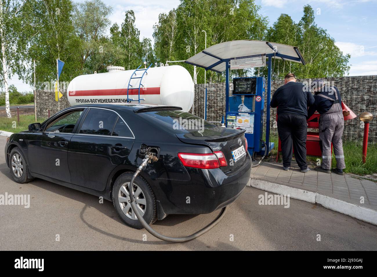 Car filling up with propane at a petrol station. (Photo by Michael ...