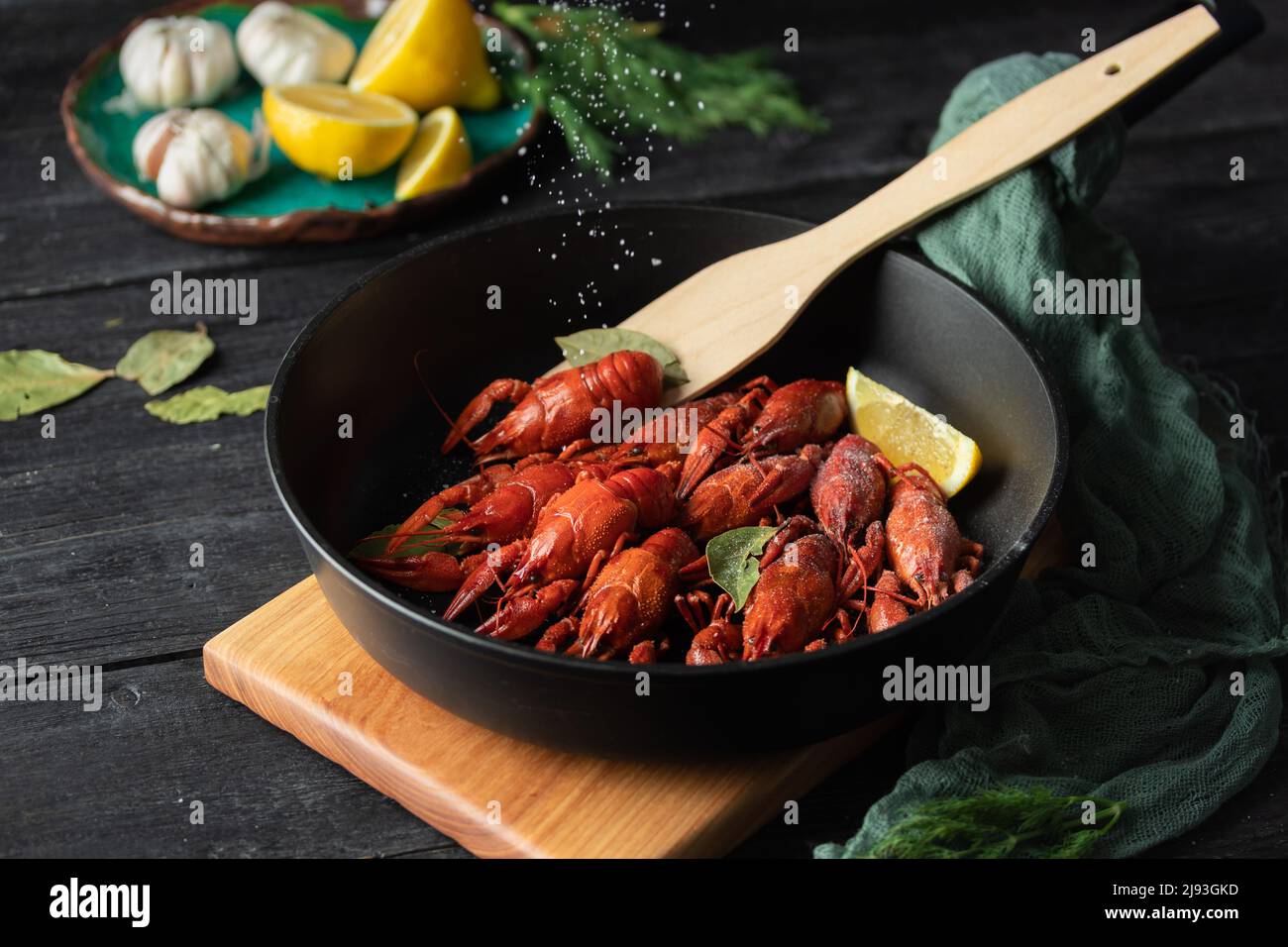 Boiled cooked crayfish ready to eat on black background Stock Photo - Alamy