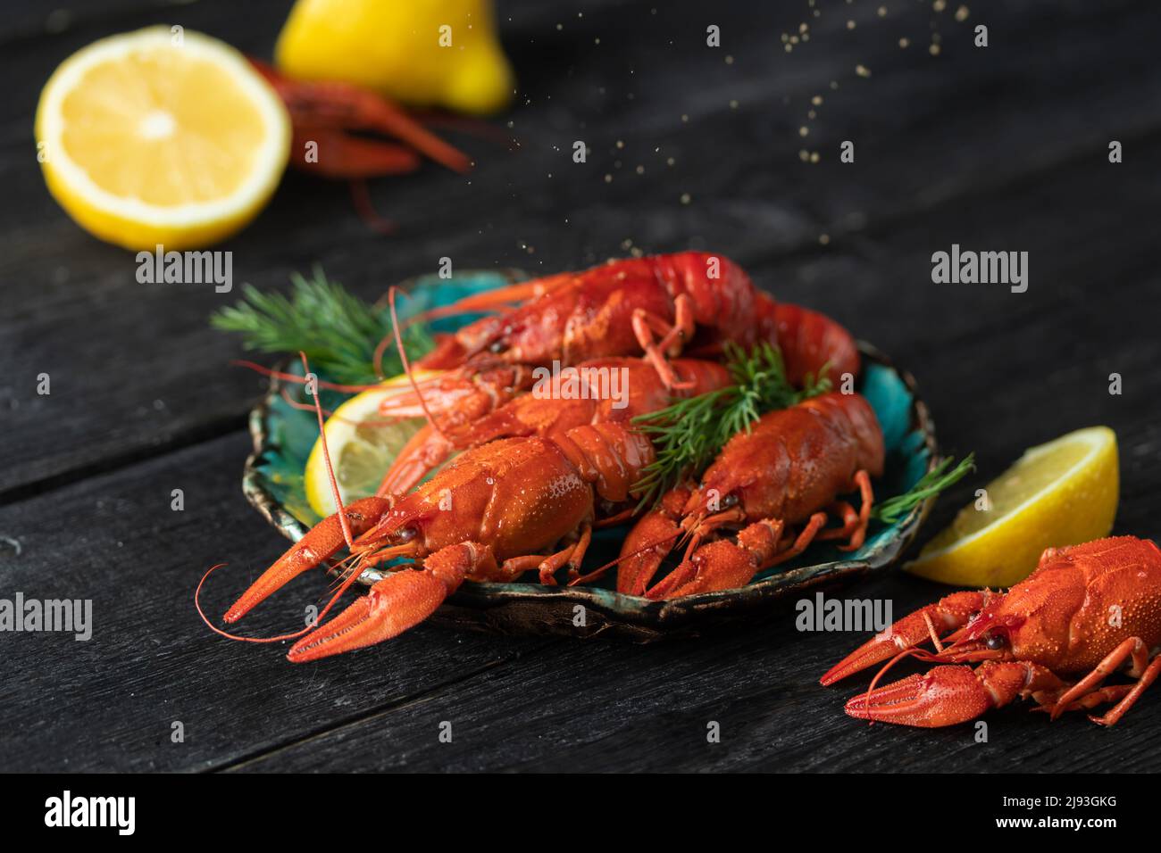 Boiled cooked crayfish ready to eat on black background Stock Photo - Alamy