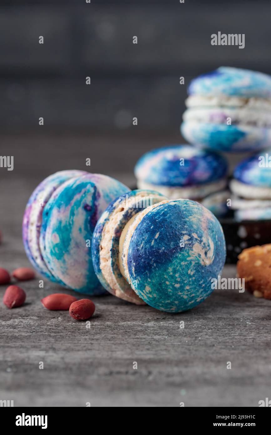 Blue macaroons on a grey concrete background. Vertical Stock Photo - Alamy