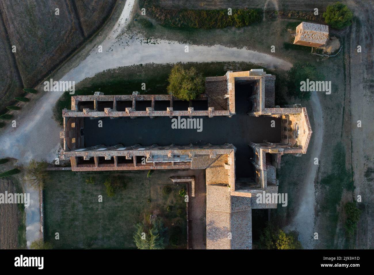 Top view of a historic roofless building in the shape of a cross in ...