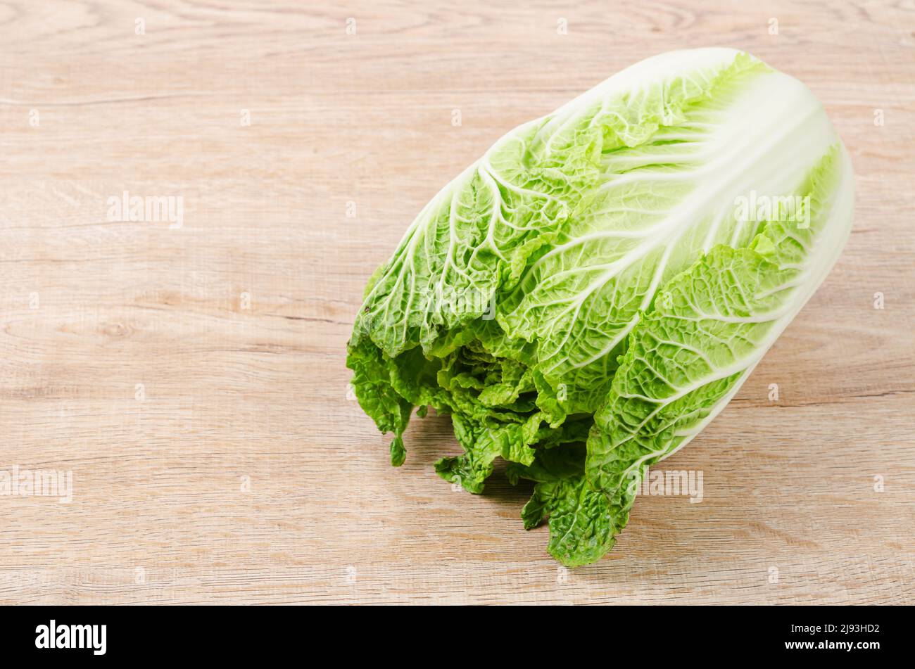 The fresh napa cabbage on white background on wooden background Stock ...