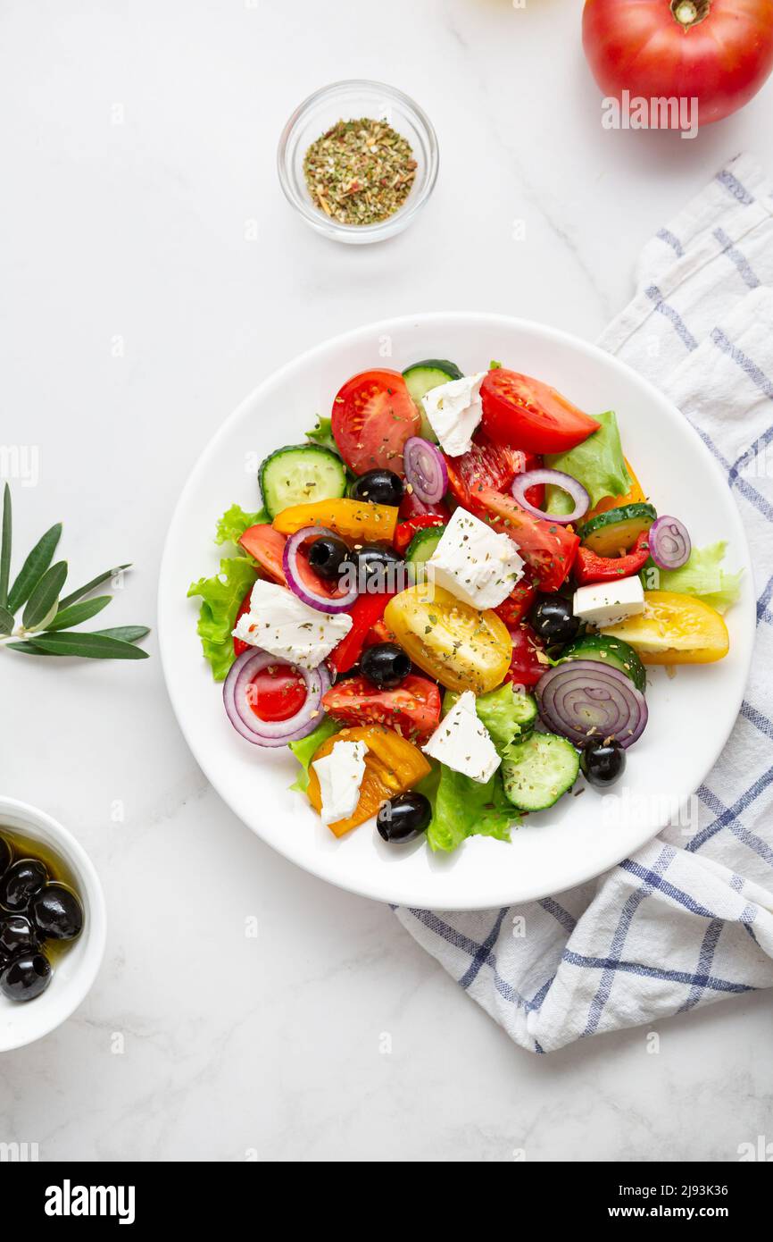 Overhead view of Greek salad on light surface mediterranean food Stock ...