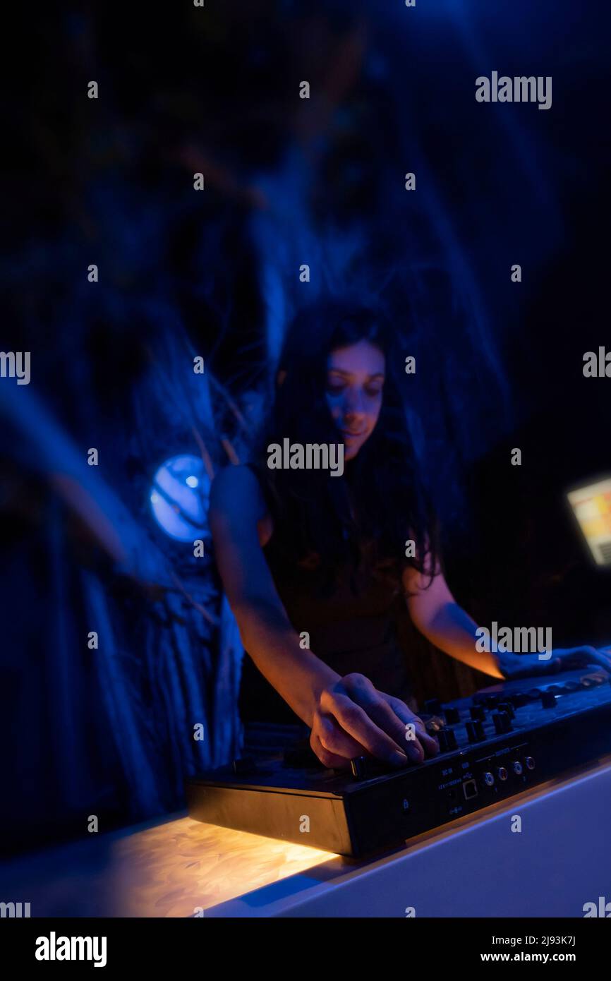 DJ using mixing desk in a club Stock Photo - Alamy