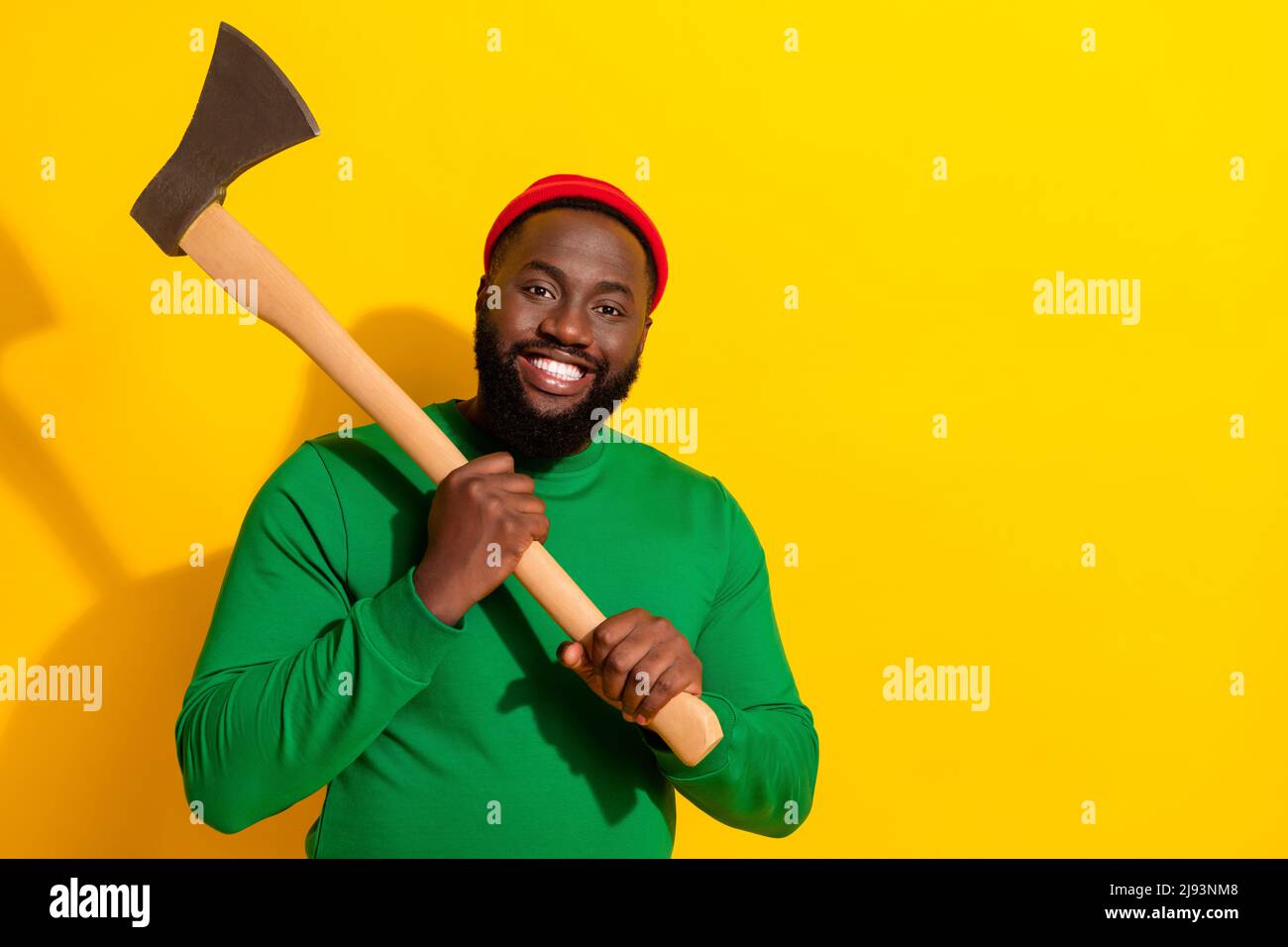 Photo of cheerful confident lumberjack worker hold sharp axe wear red ...