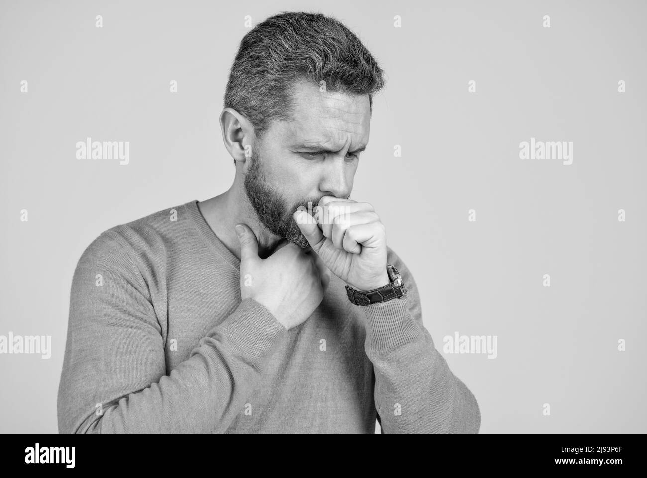 sick man has cough on grey background. mens health. male casual fashion ...