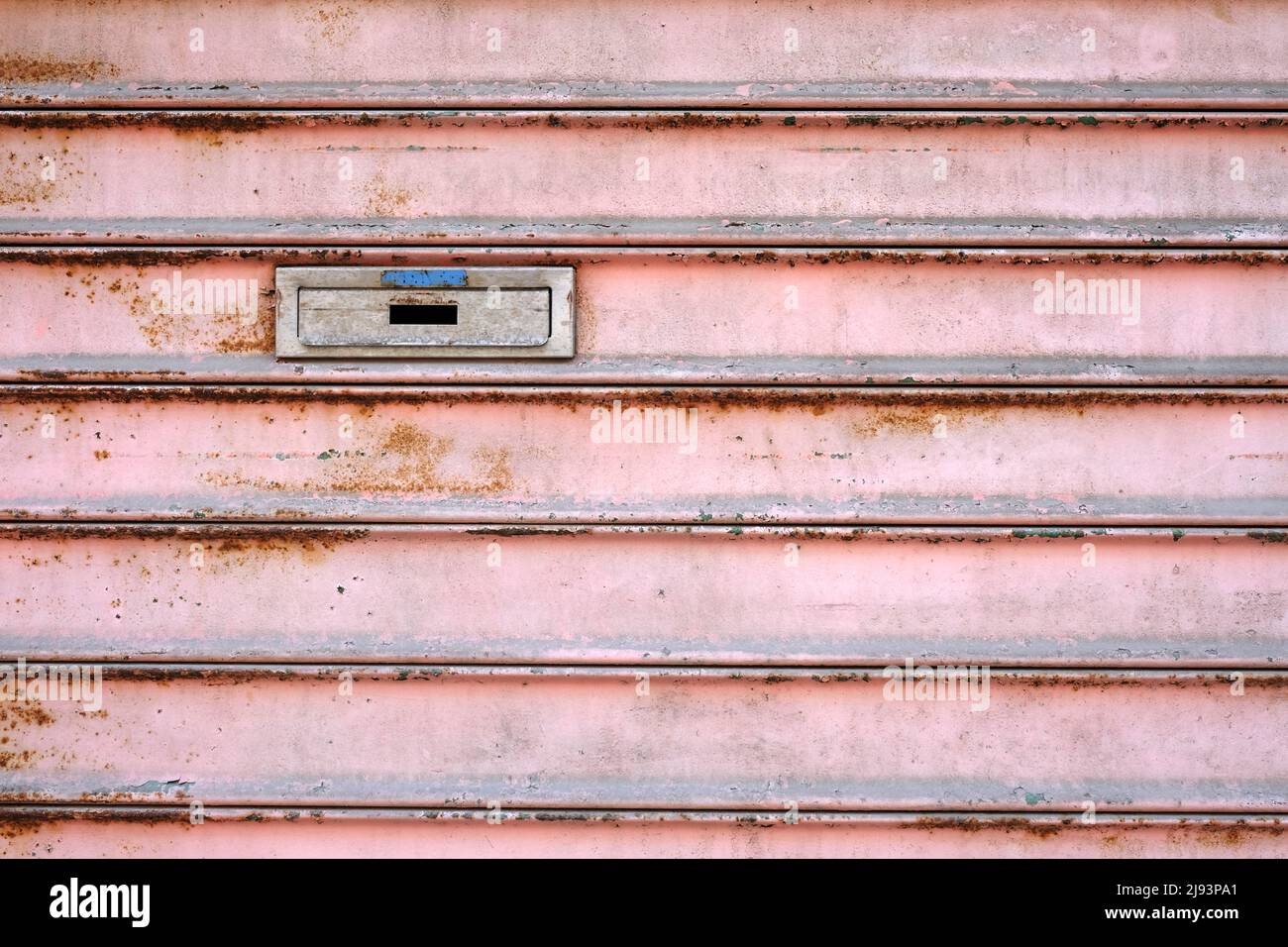 Letterbox on a weathered metal door Stock Photo - Alamy