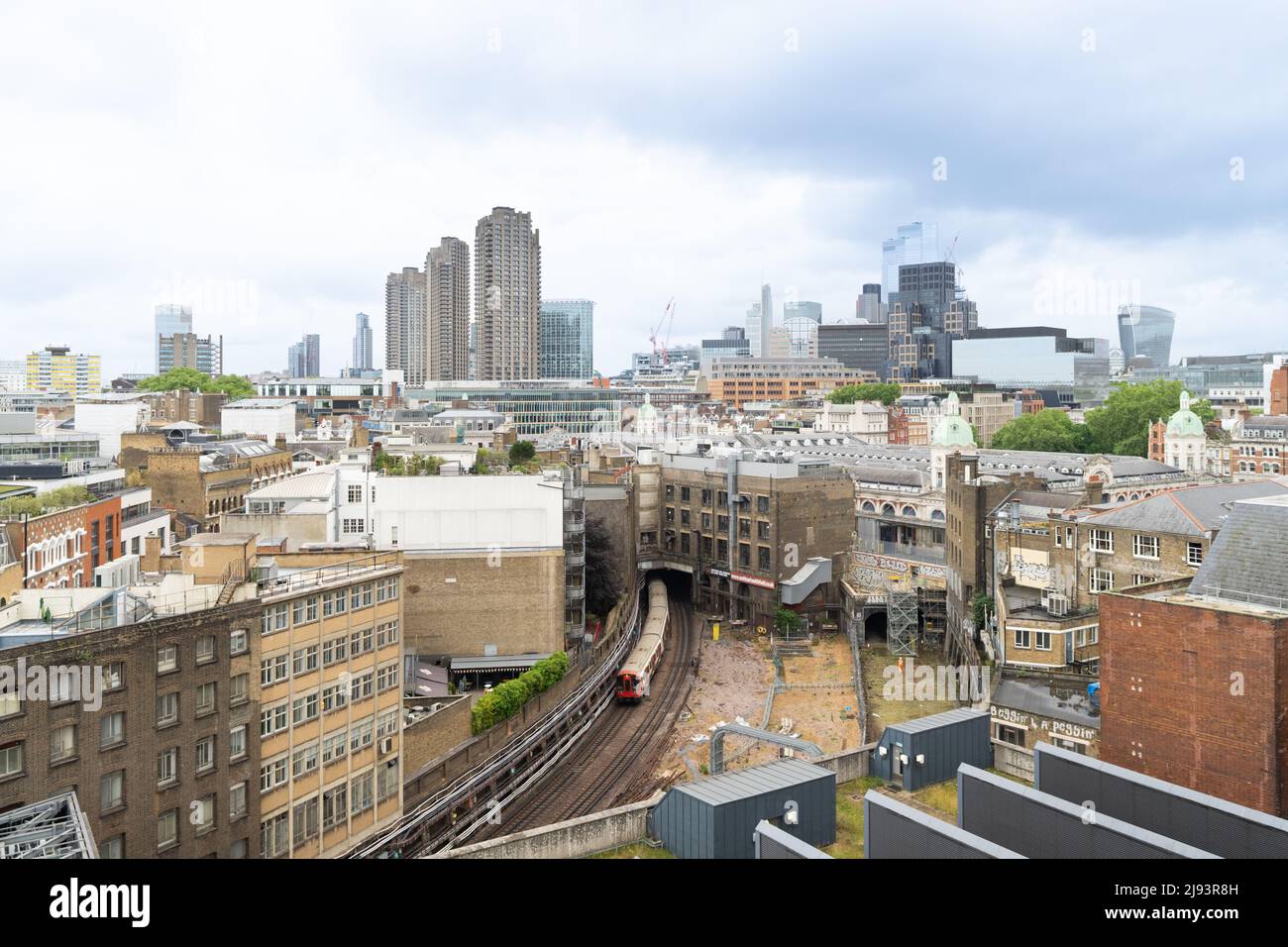 London underground tube train emerges from underpass at Farringdon ...