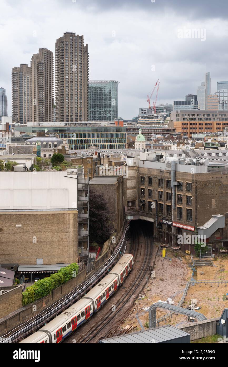 London underground tube train emerges from underpass at Farringdon ...