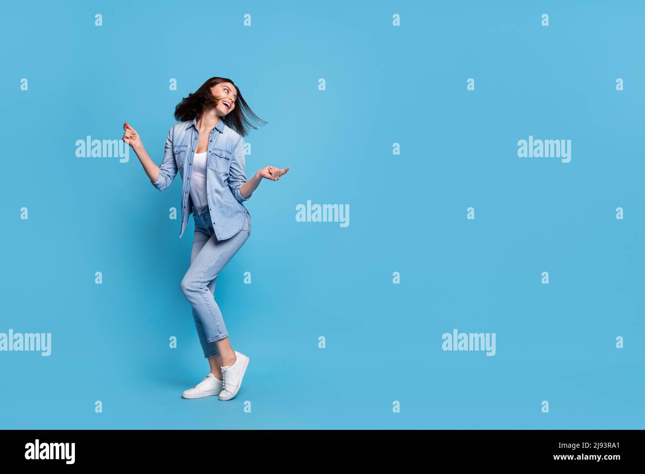 Photo of excited pretty lady dressed denim shirt looking empty space ...