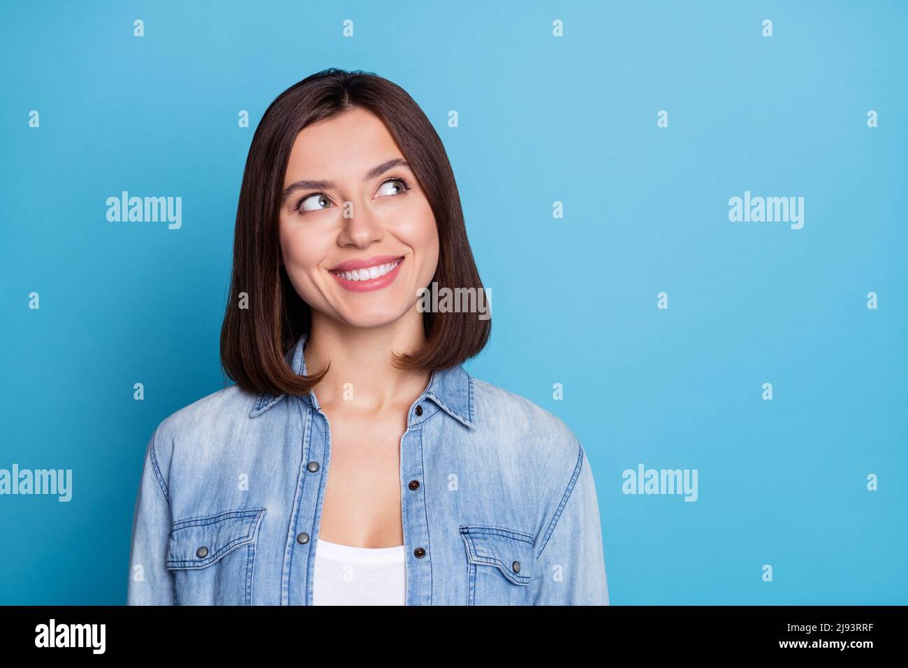 Photo of positive minded girl toothy smile look interested empty space ...