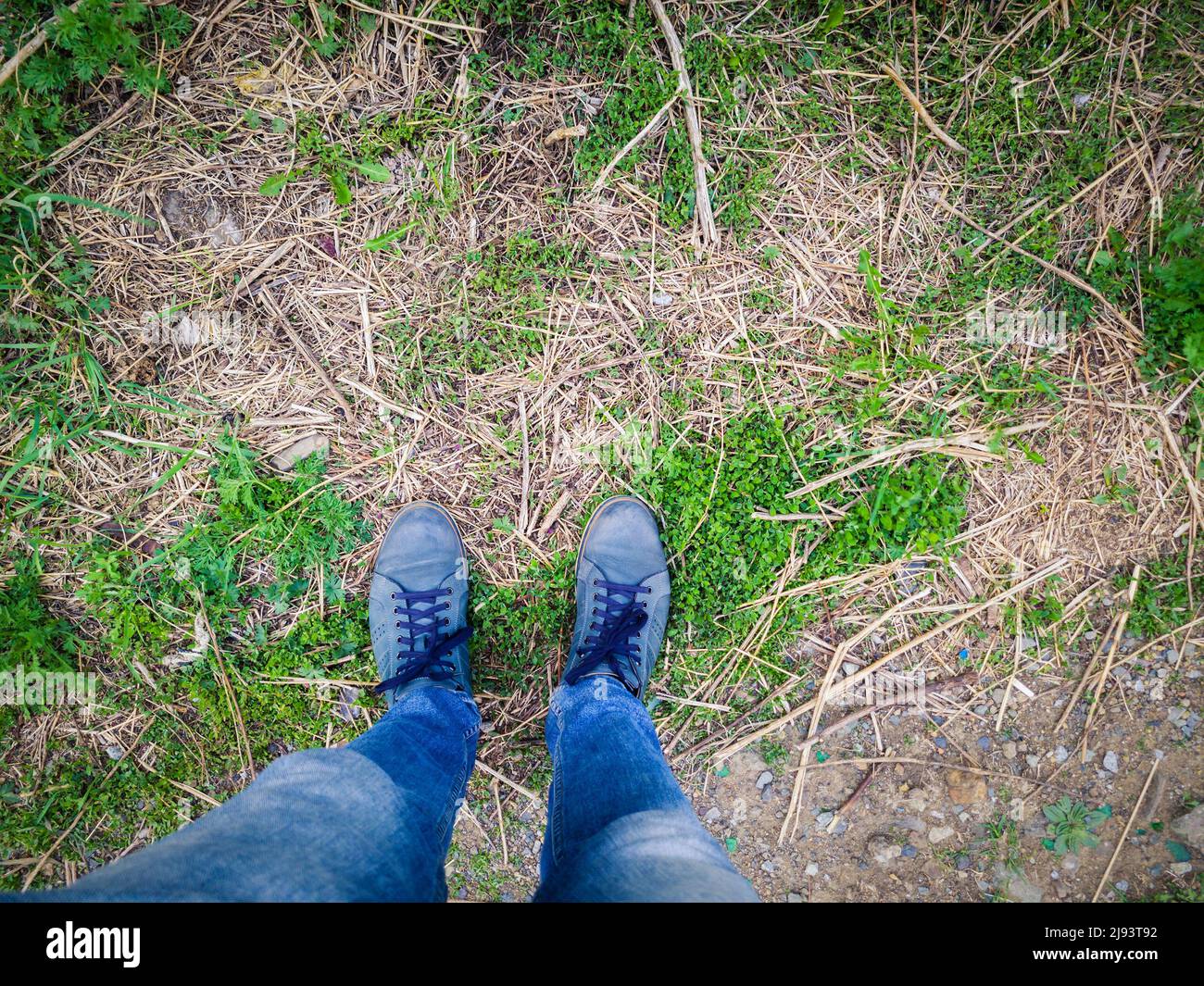 Top view of boots on green grass Stock Photo - Alamy