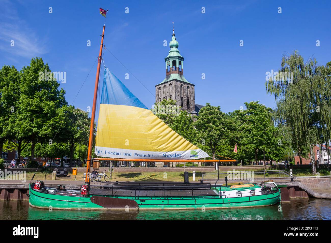 Historic wooden ship in front of the church tower of Nordhorn, Germany ...