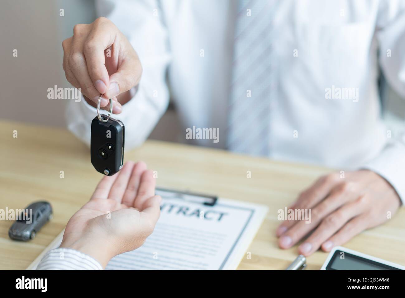 Insurance concept the customer receiving the car key after finishing ...