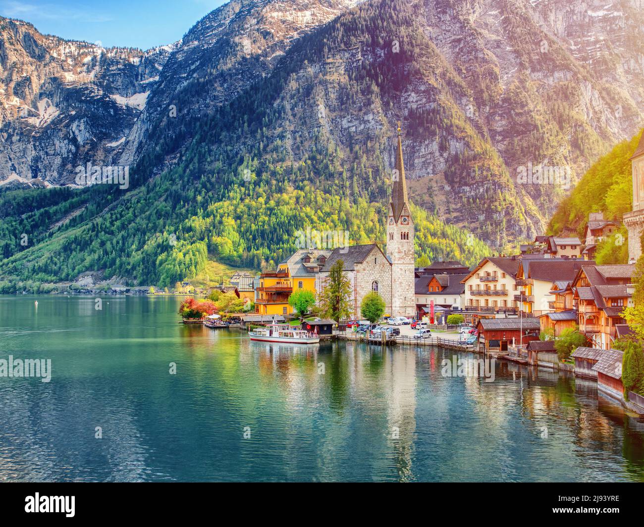 Scenic picture-postcard view of famous Hallstatt mountain village in the Austrian Alps at ...