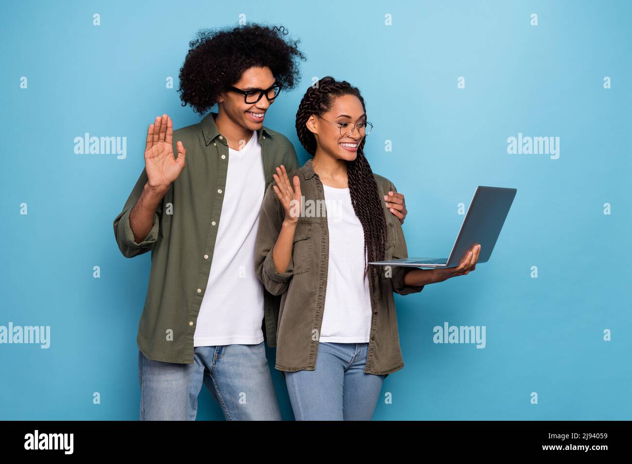 Photo of two people work remote wave hands speak hello hi colleagues ...