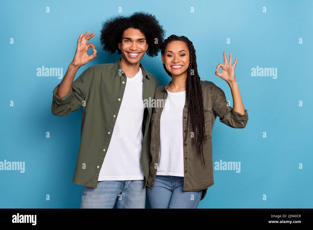 Photo of two cheerful partners hand fingers demonstrate okey symbol ...