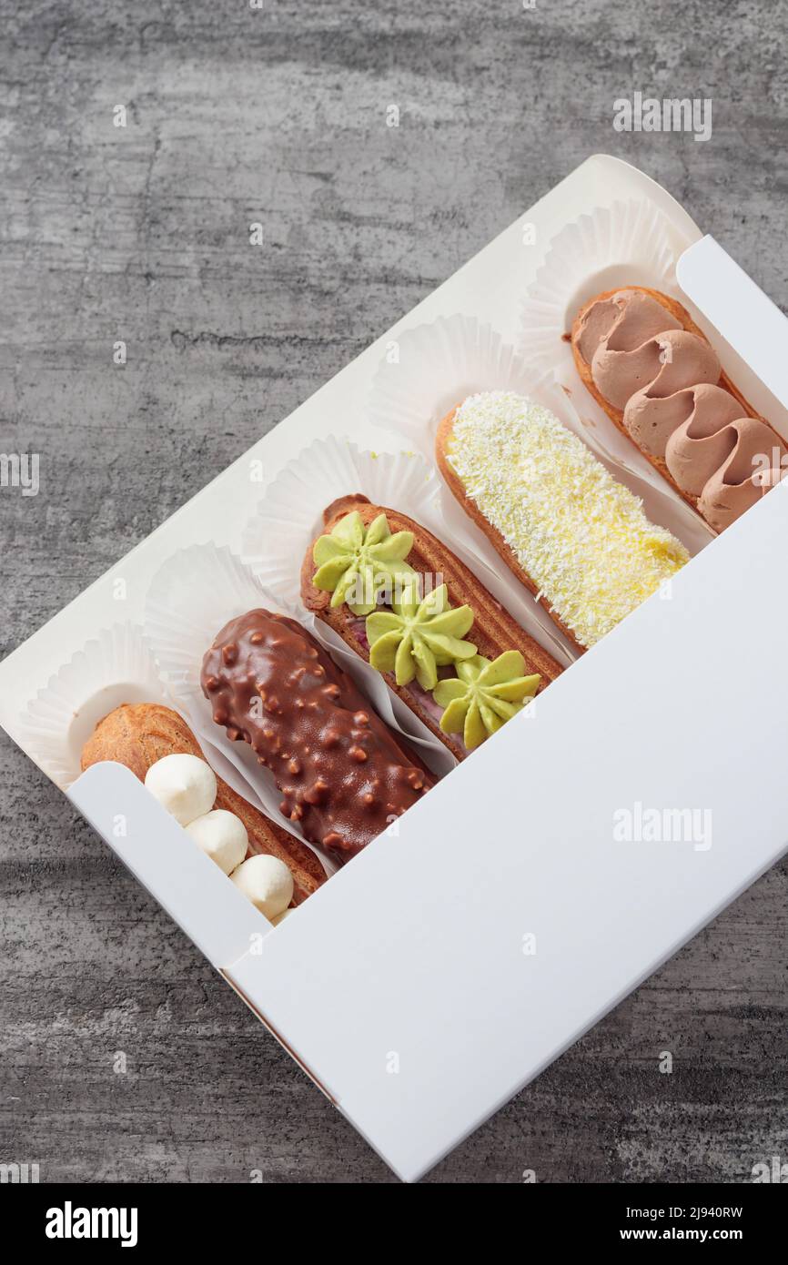 Set of French dessert sweet eclairs Stock Photo - Alamy