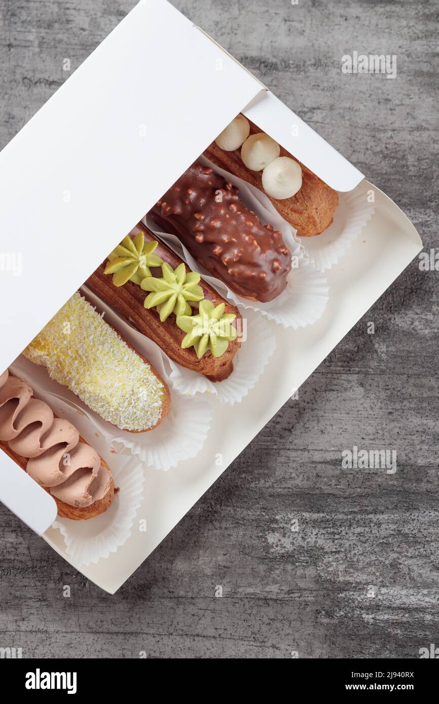 Set of French dessert sweet eclairs Stock Photo - Alamy