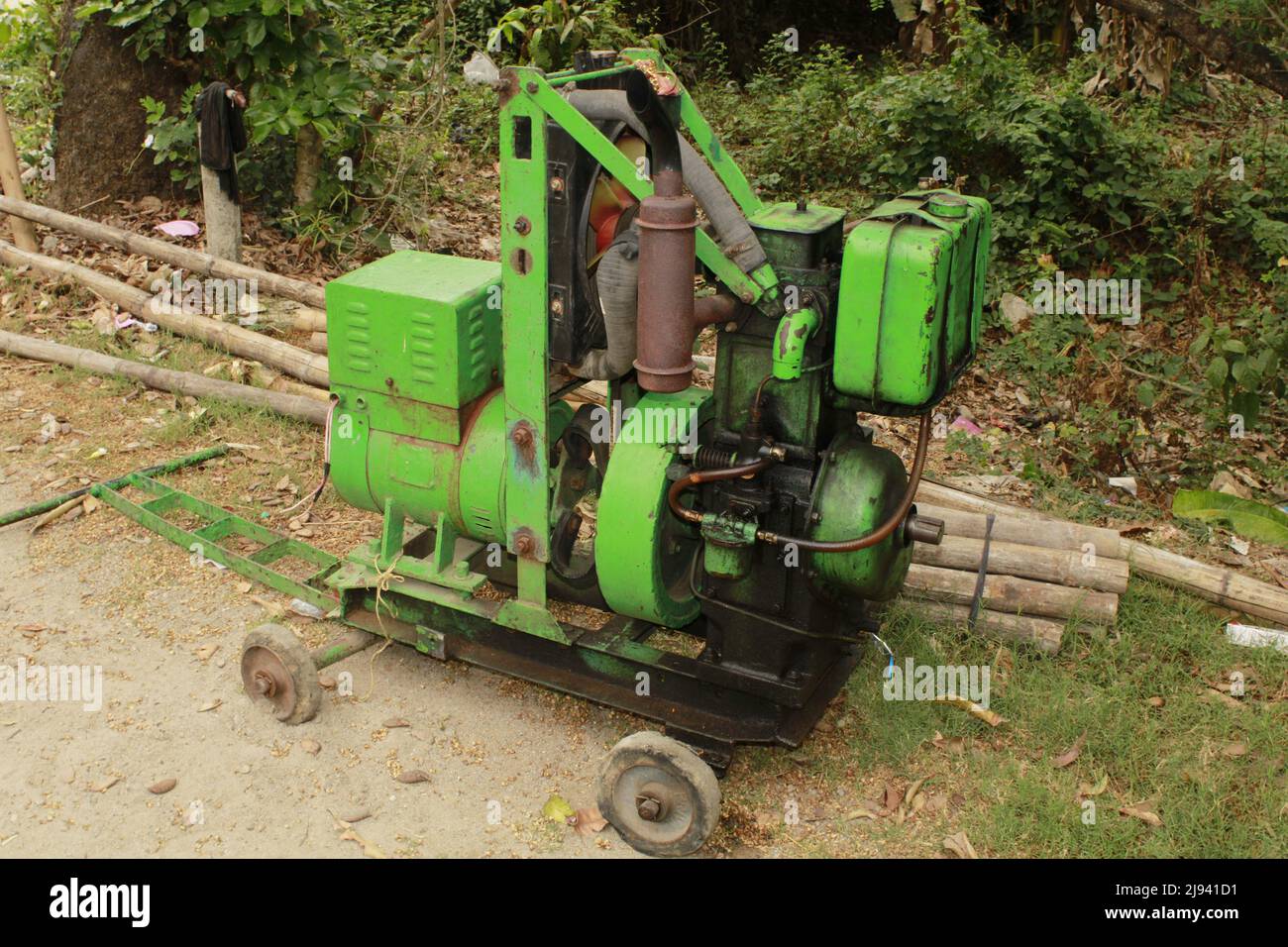 Large green colour electrical power generator. Electrical generator ...