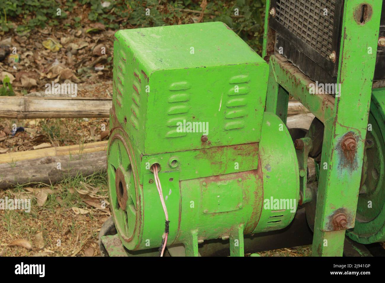 Large green colour electrical power generator. Electrical generator ...