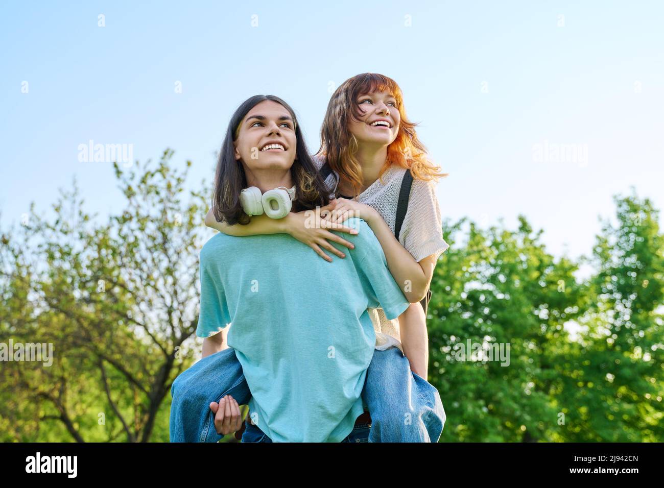 Couple of happy having fun teenagers together outdoor Stock Photo - Alamy