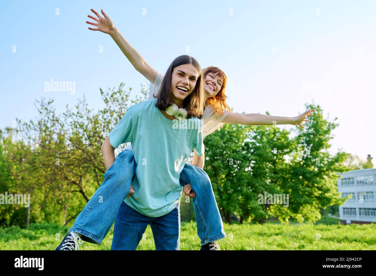 Couple of happy having fun teenagers together outdoor Stock Photo - Alamy