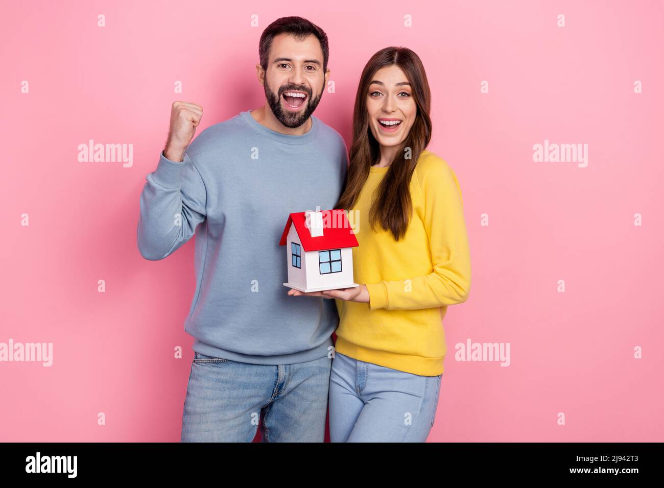 Portrait of beautiful handsome friends friendship holding new home ...