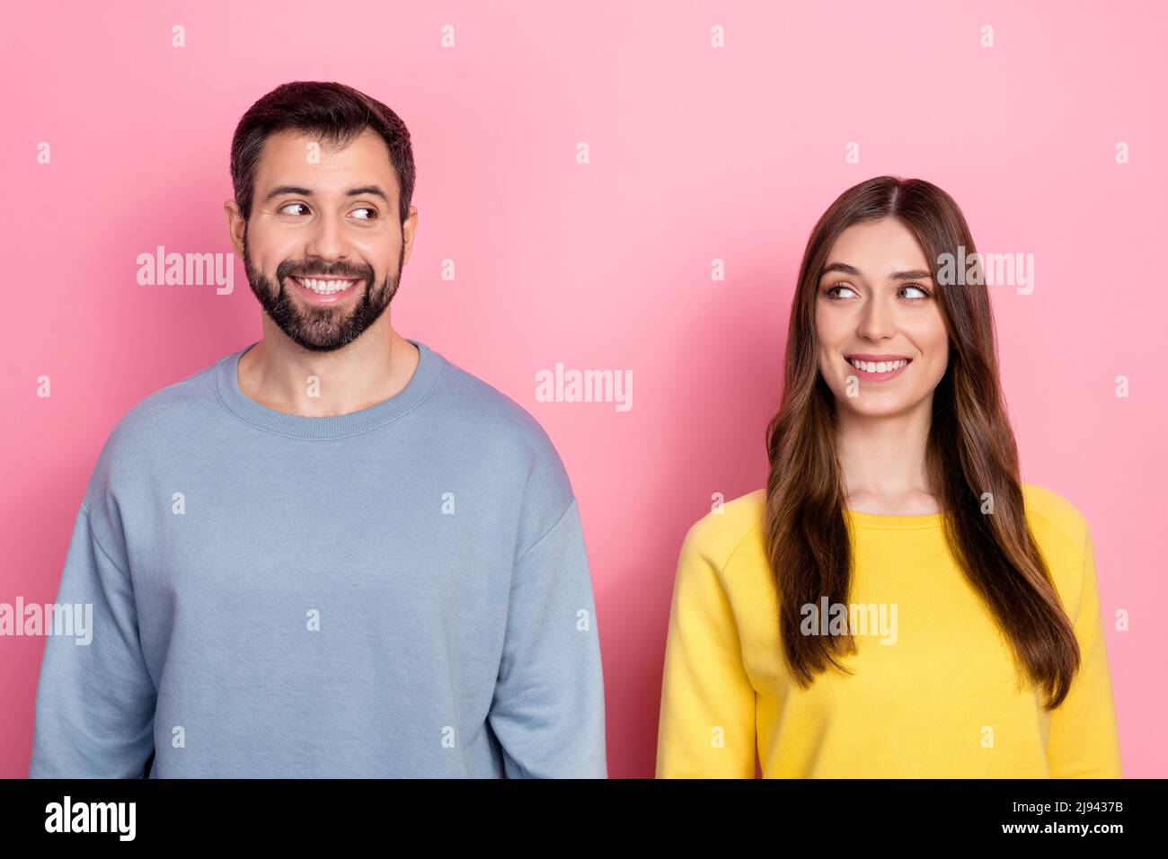 Portrait of two positive nice people toothy smile look each other ...
