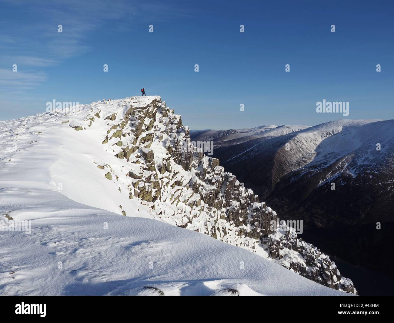 Lone hill walker on the top of Sgor Gaoith, by No 5 Buttress. Looking ...