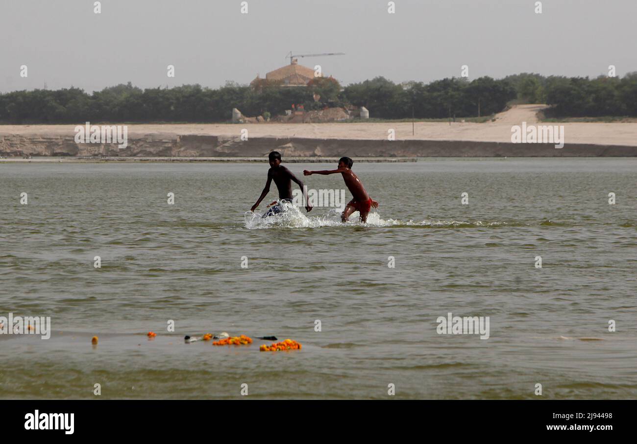Prayagraj, India. 20/05/2022, Indian boys take bath in holy river ...