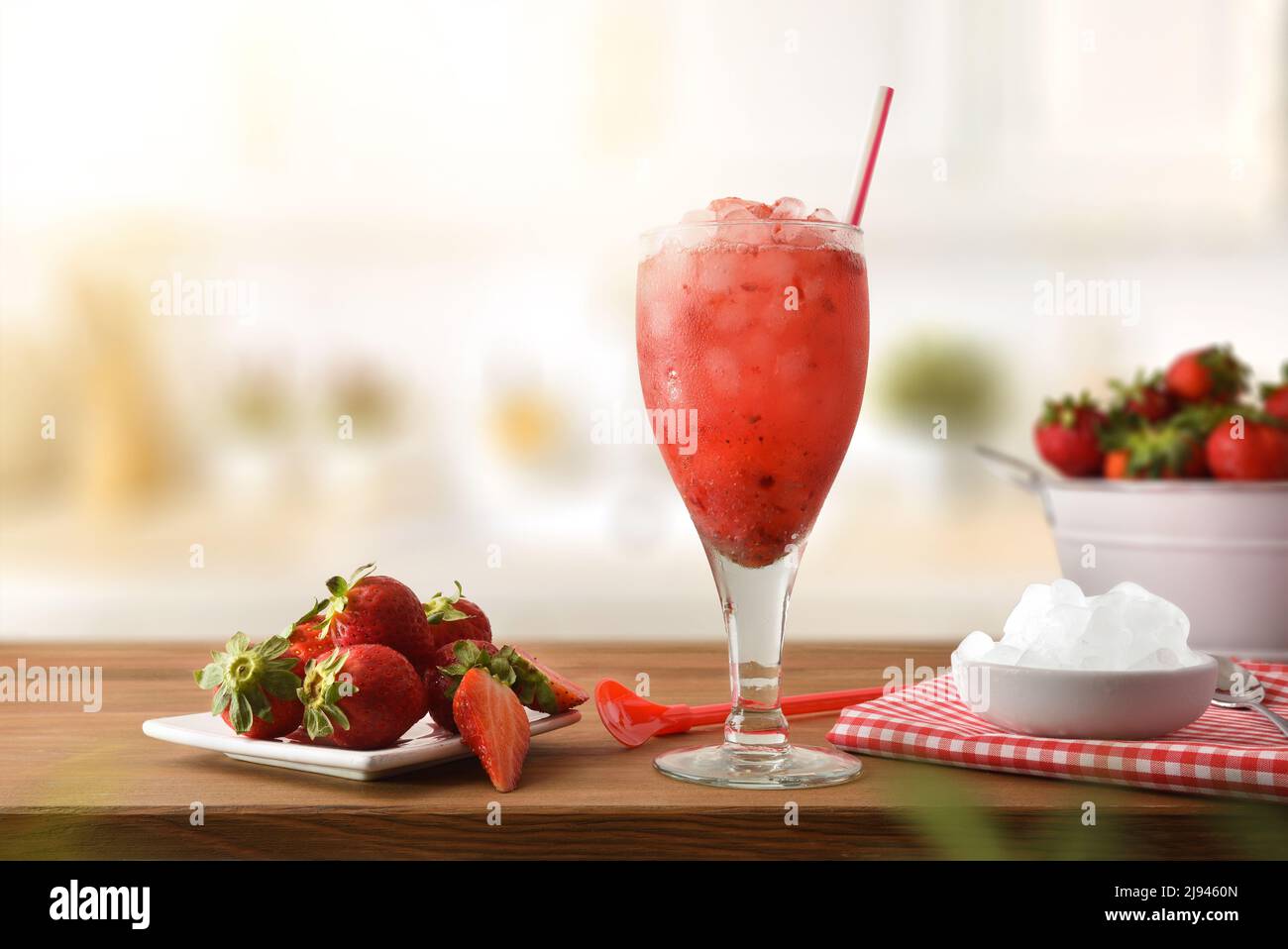 Fruit granita with ripe fruit on a plate and crushed ice in a bowl on ...