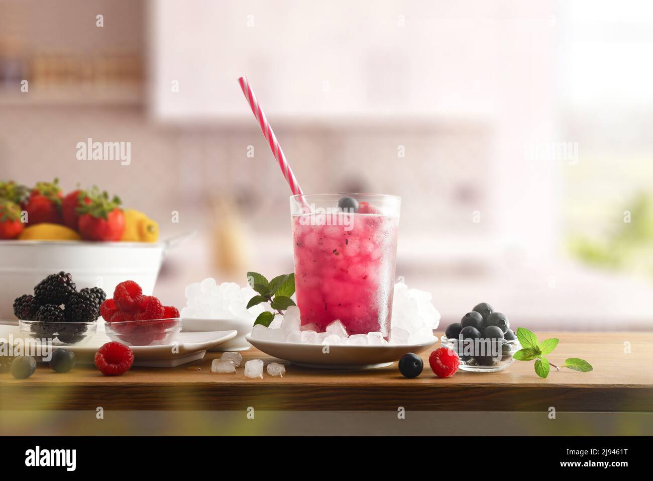 Refreshment with fruit of the forest drink with fruit and ice around it ...