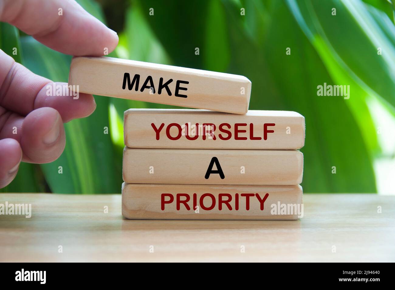 Make yourself a priority text on wooden blocks Stock Photo - Alamy