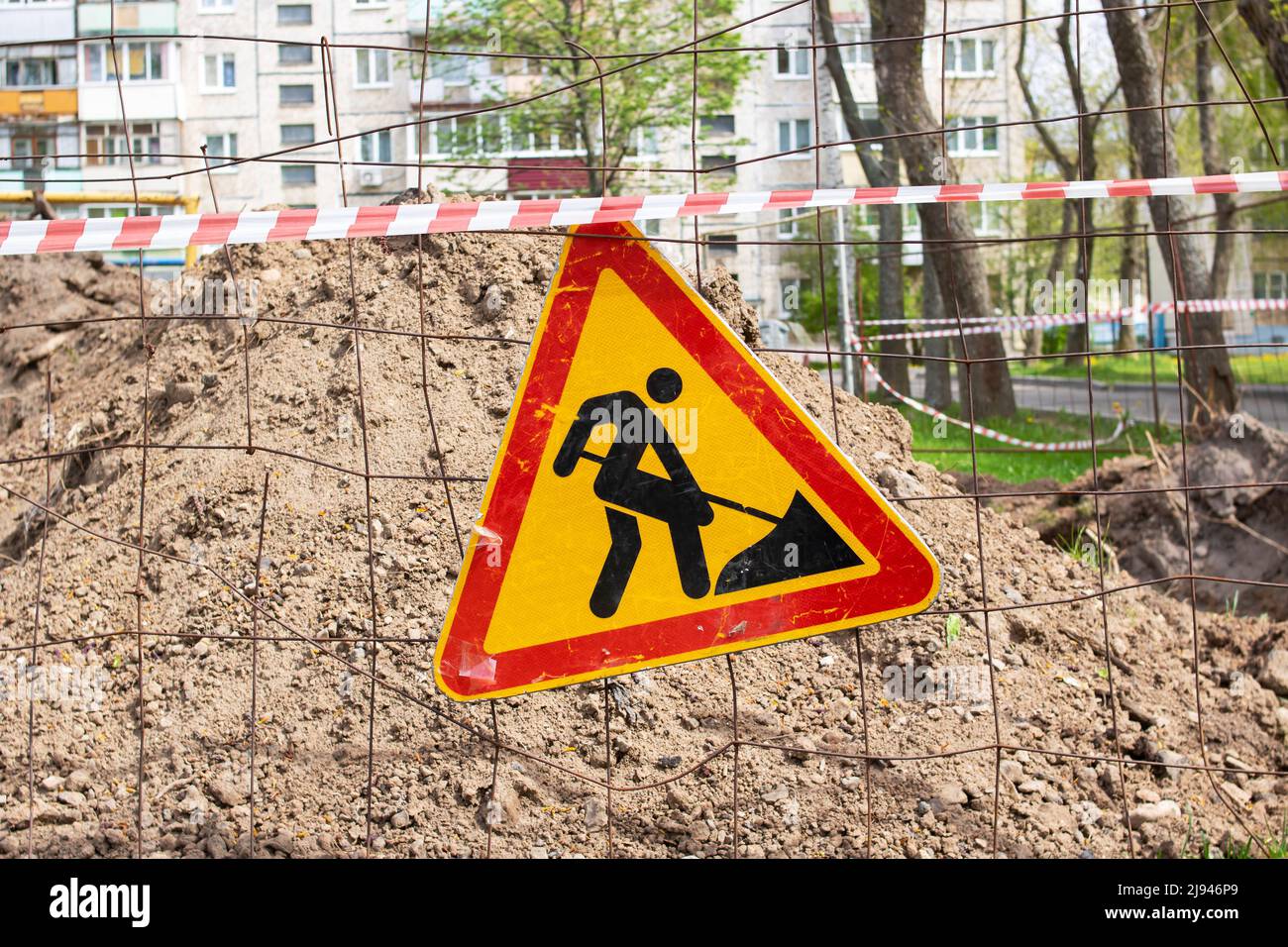 Roadworks, under construction. Earthwork sign on fence Stock Photo - Alamy