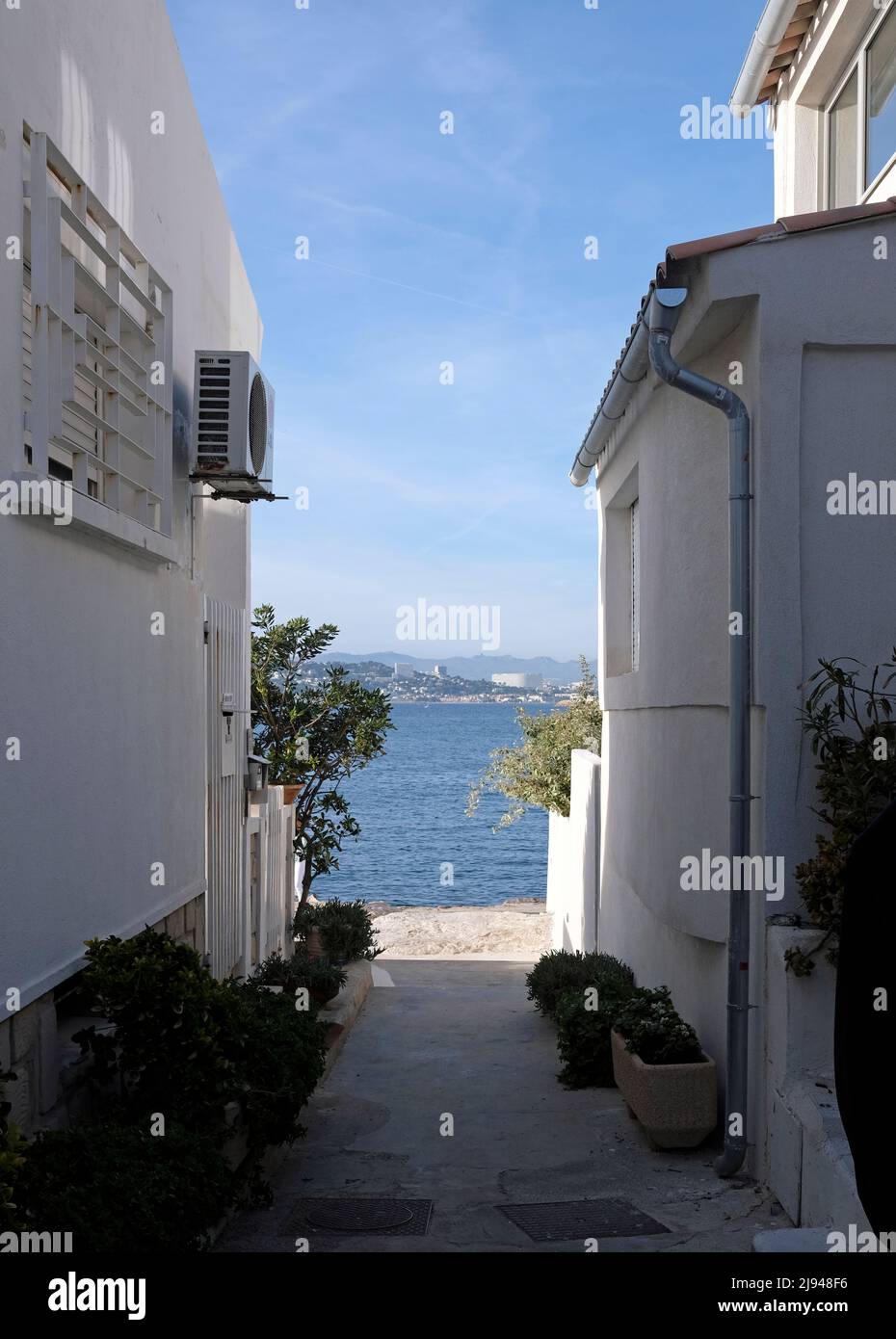 View of the Mediterranean Sea between two buildings in Marseille ...