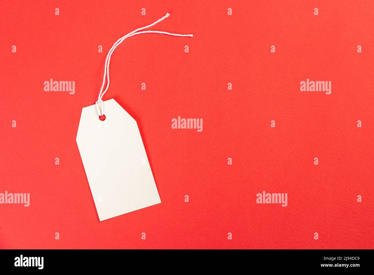 white price tag on a red background, price tag for goods Stock Photo ...