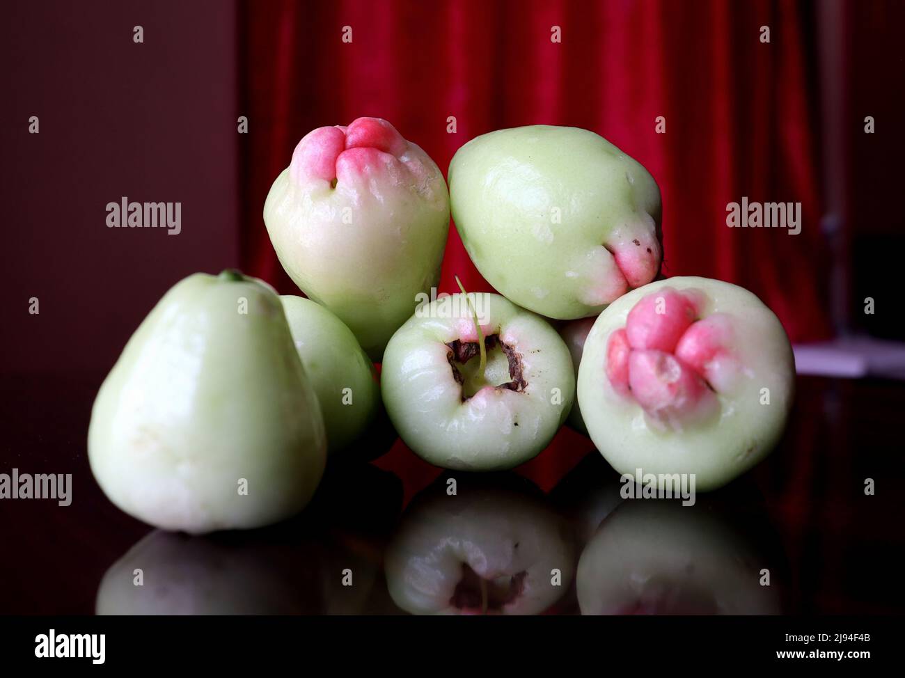 Wax Apples,White and red Jamrul on a reflective surface Some fresh ...