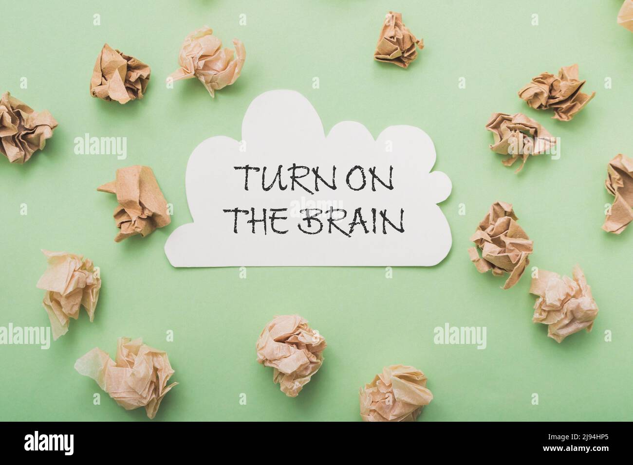 Composition with phrase Turn On Brain on green background Stock Photo ...
