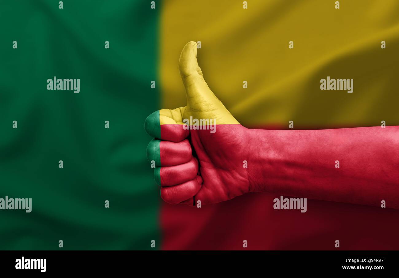 Hand making thumb up painted with flag of benin Stock Photo - Alamy