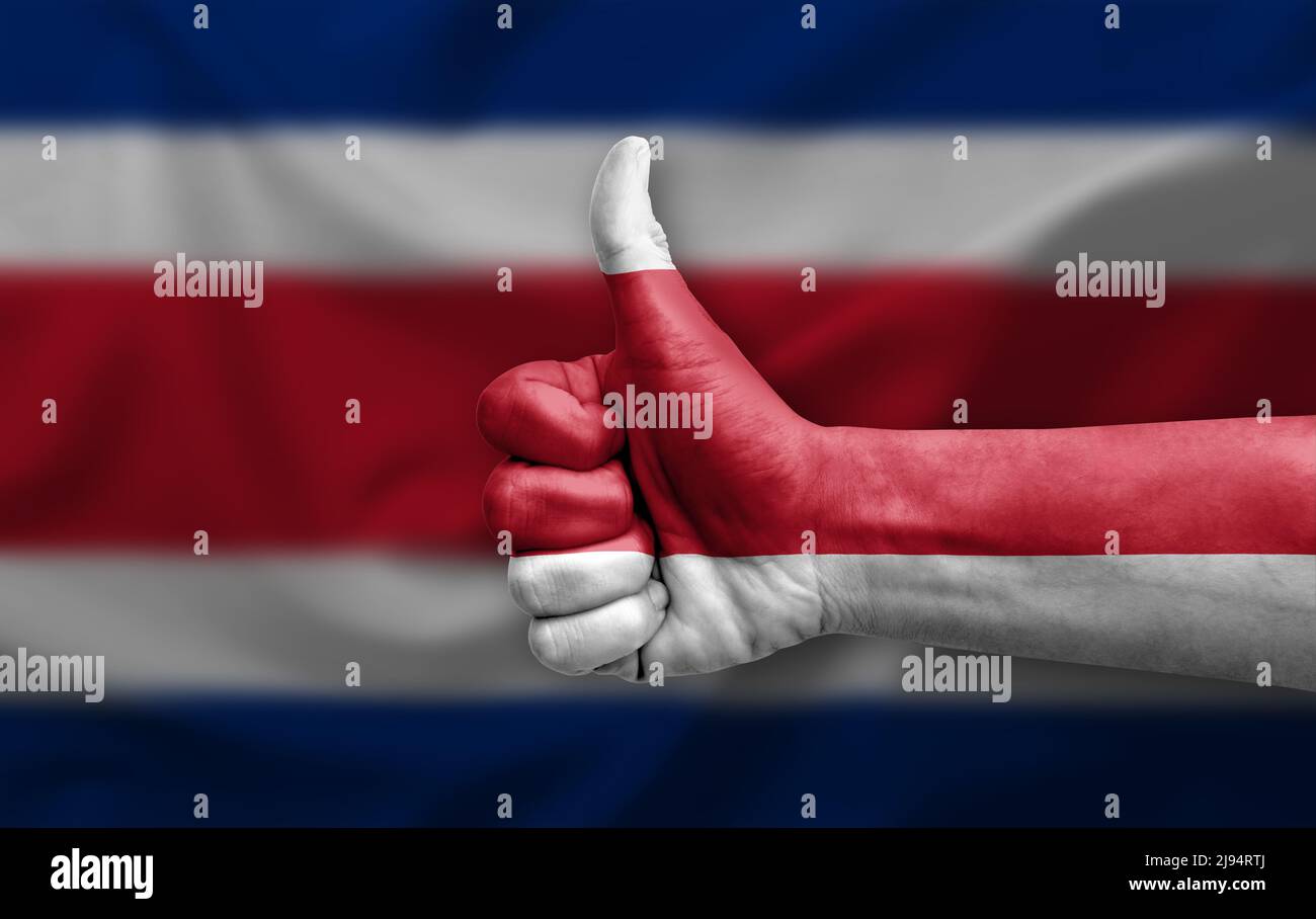 Hand making thumb up painted with flag of costa rica Stock Photo - Alamy