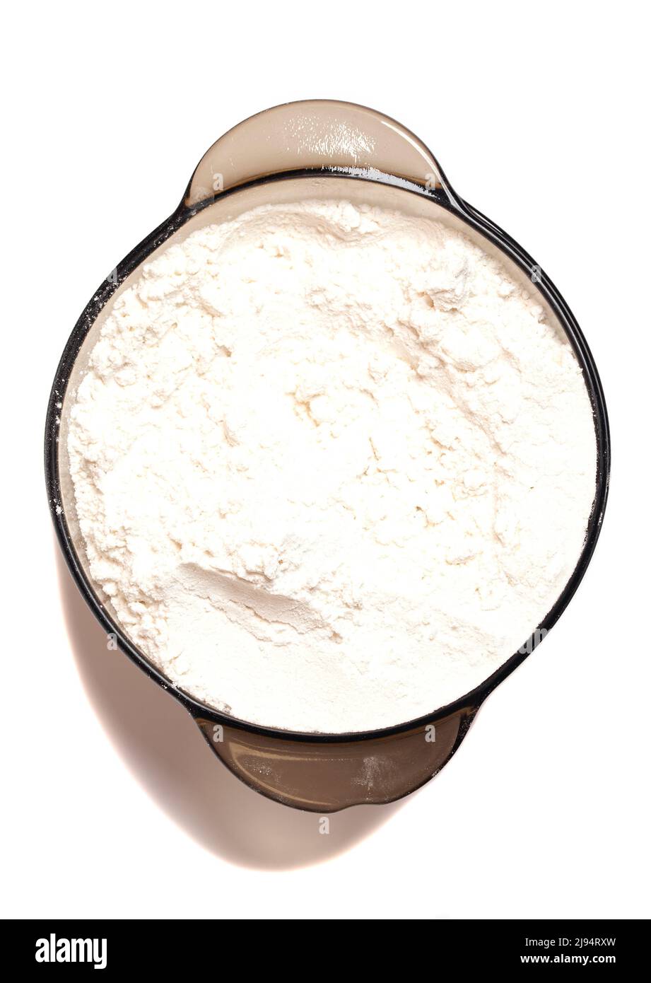 Wheat flour in bowl isolated on white background, top view Stock Photo ...