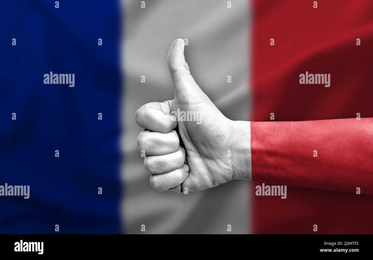 Hand making thumb up painted with flag of france Stock Photo - Alamy