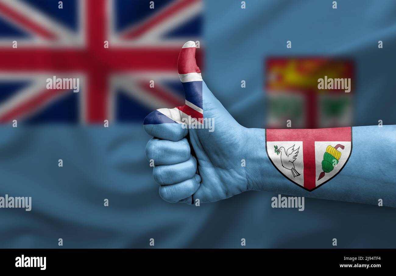 Hand making thumb up painted with flag of fiji Stock Photo - Alamy