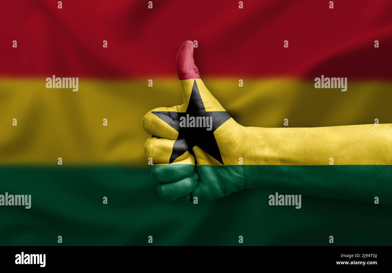 Hand making thumb up painted with flag of ghana Stock Photo - Alamy