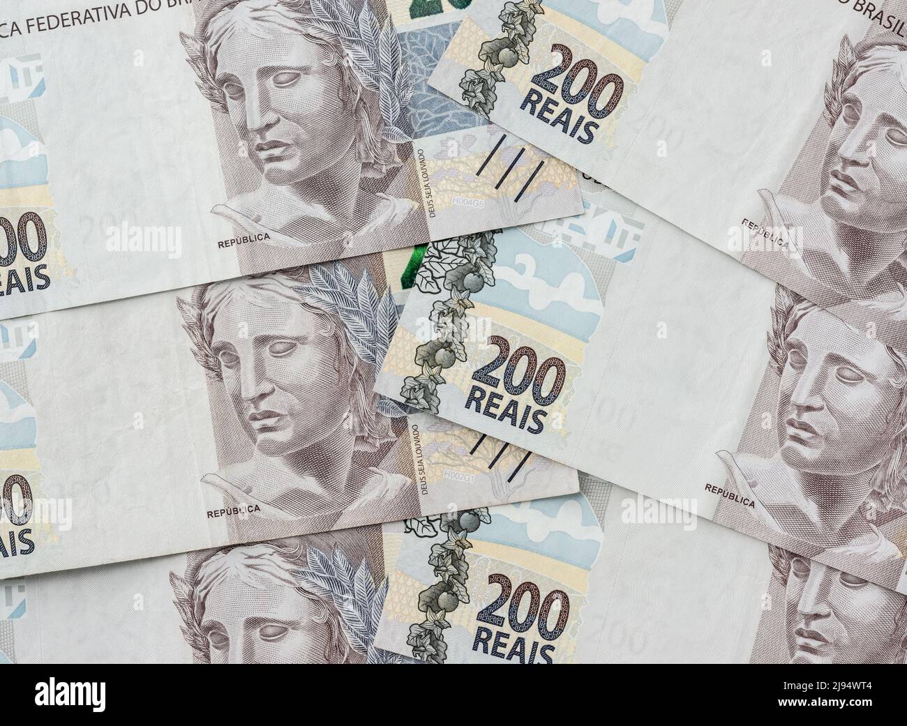 A group of two hundred brazilian real bills spread Stock Photo - Alamy