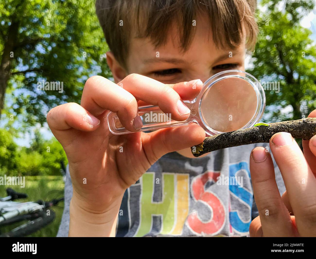 Kid Looking Through Magnifying Glass