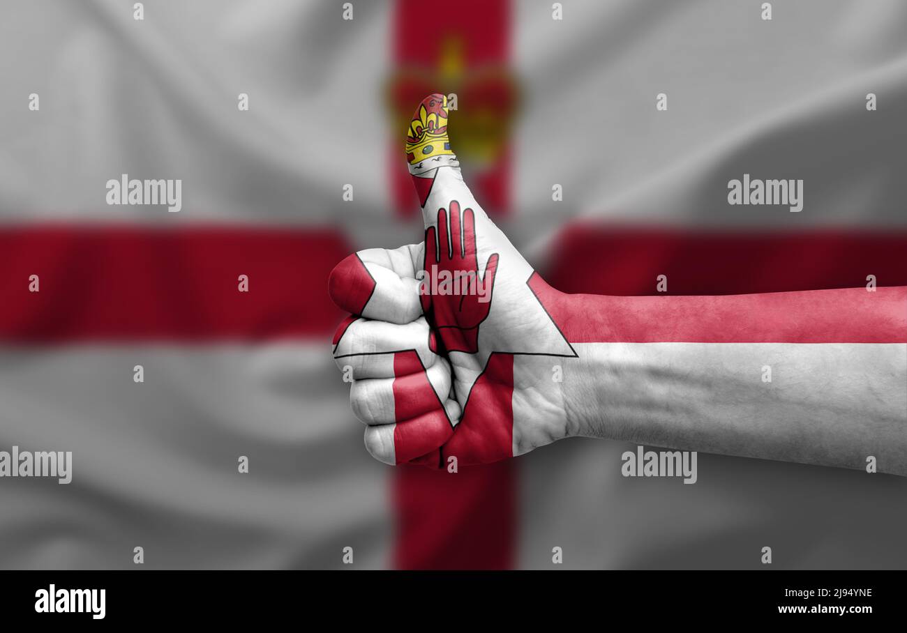 Hand making thumb up painted with flag of northern ireland Stock Photo ...