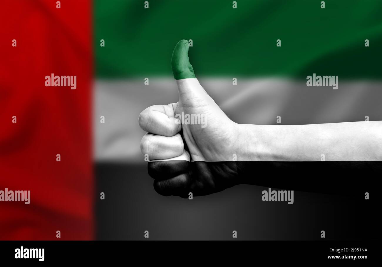 Hand making thumb up painted with flag of uae Stock Photo - Alamy